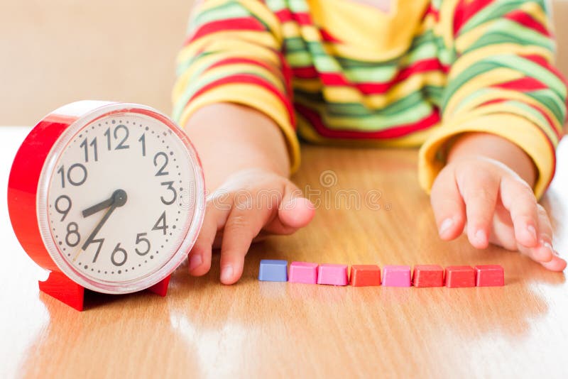Little Cute Baby with Clock Stock Photo - Image of girl, person: 28595304