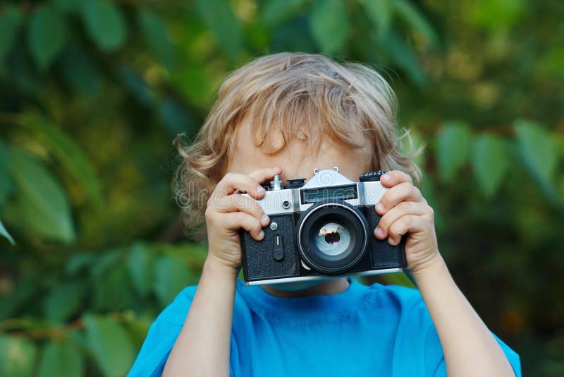 Little Cute Blond Boy with a Camera Shoots You Stock Photo - Image of ...
