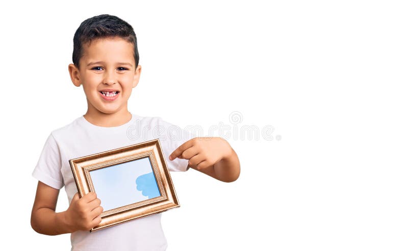 Little Cute Boy Kid Holding Empty Frame Smiling Happy Pointing with ...