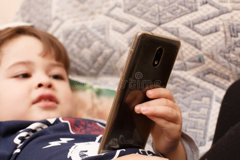 Boy with Smartphone at Home Playing Stock Image - Image of cellphone ...