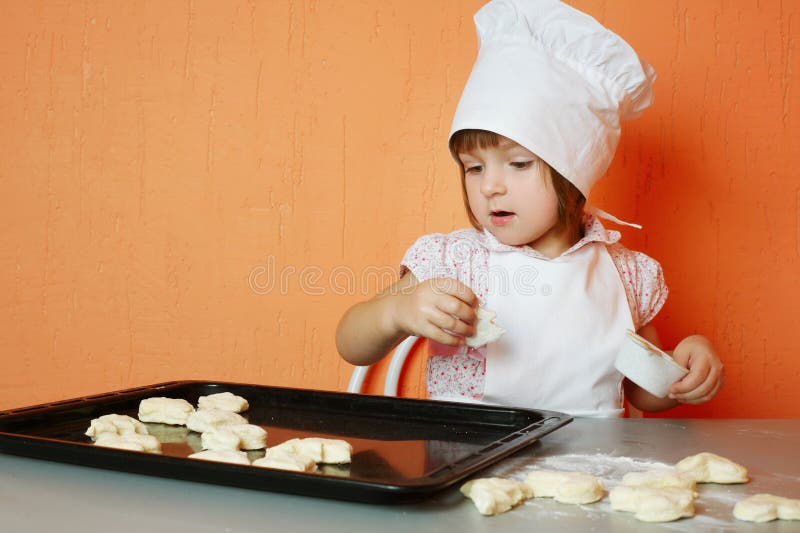 Little Cute Chef Cooking Biscuits Stock Photo - Image of female, orange ...