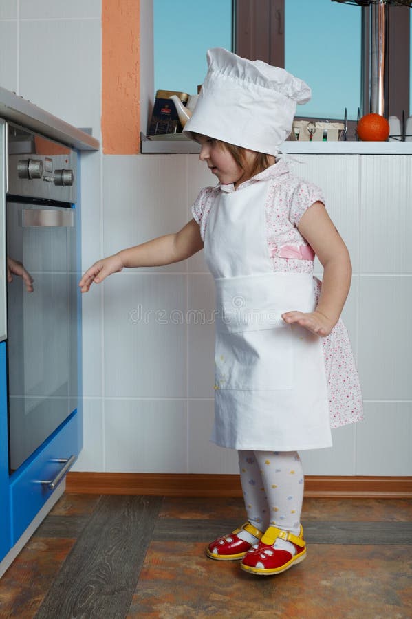 Little Cute Chef Cooking in the Oven Stock Photo - Image of looking ...