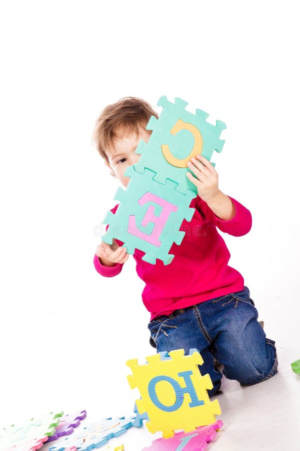 Little Cute Girl Solving Alphabet Puzzle Stock Photos - Free & Royalty ...