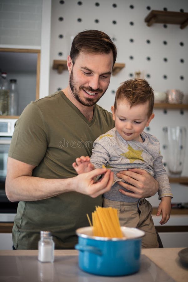 Little daddy`s cook stock photo. Image of parent, home - 180256498