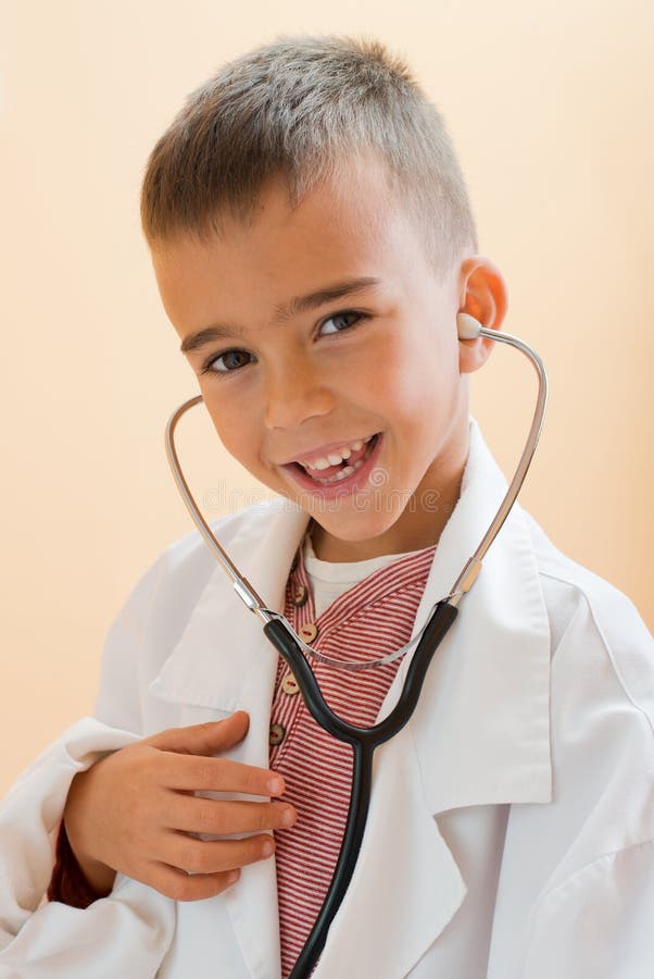 Little Doctor Looking at Camera Stock Photo - Image of play, gown ...