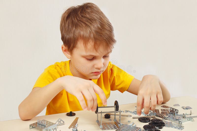 Little Engineer Plays with Mechanical Starter Kit at Table Stock Image ...