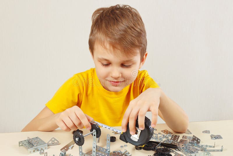 Little Engineer Plays with Metal Constructor at Table Stock Image ...