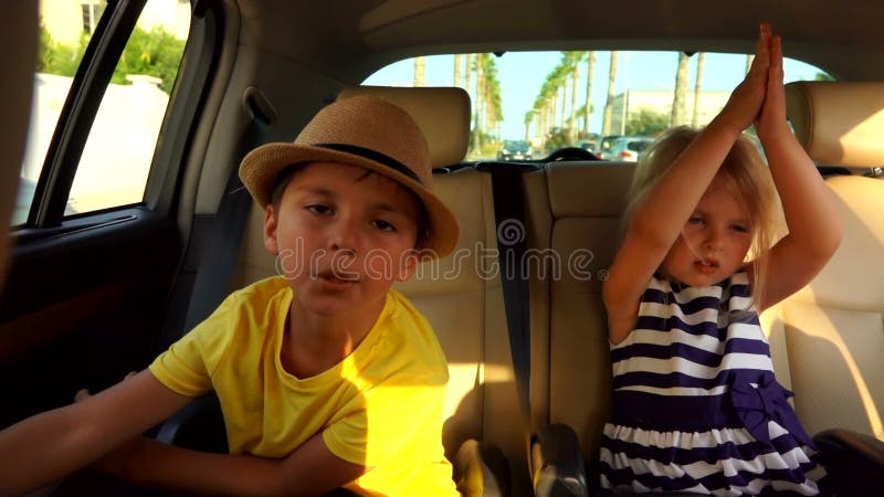 Cute Little Children Ride in Car and Look Around with Interest Stock ...