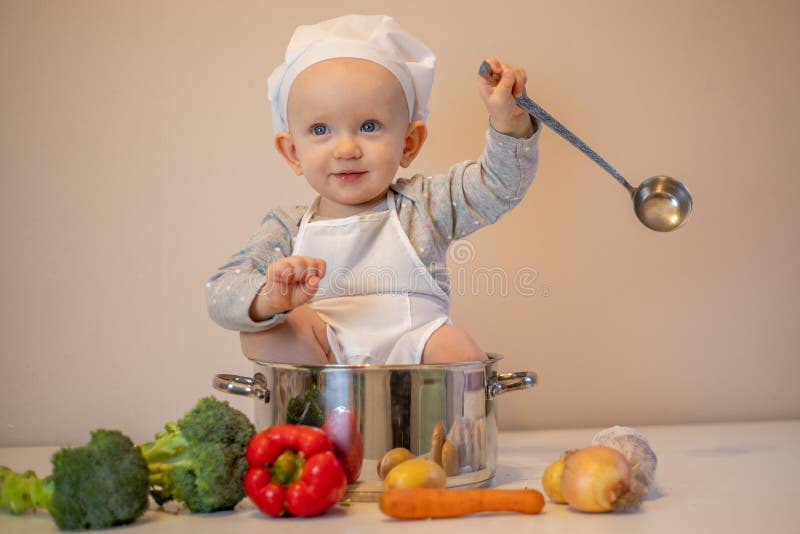 Little Female Chef Preparing Vegetable Soup in Kitchen Stock Image ...