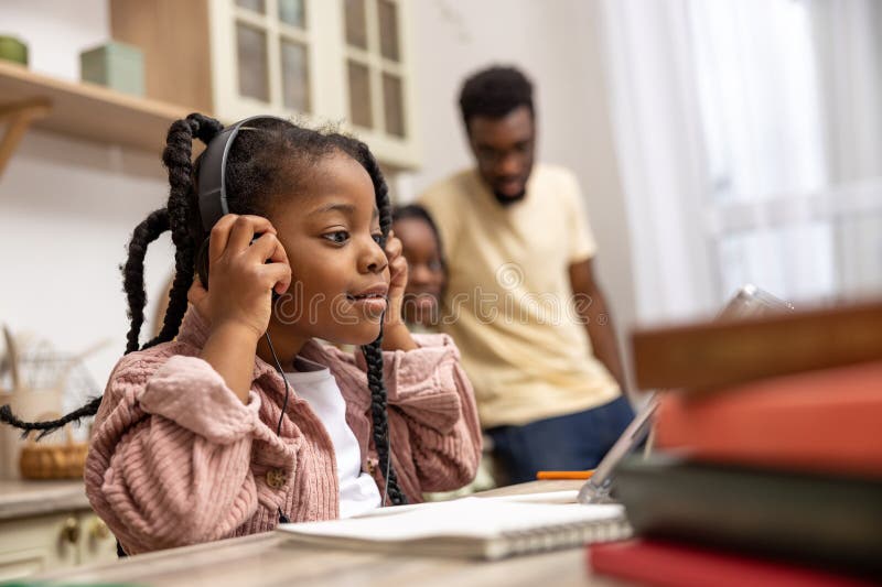 Little Female Pupil Using Her Tablet for Remote Learning Attending ...
