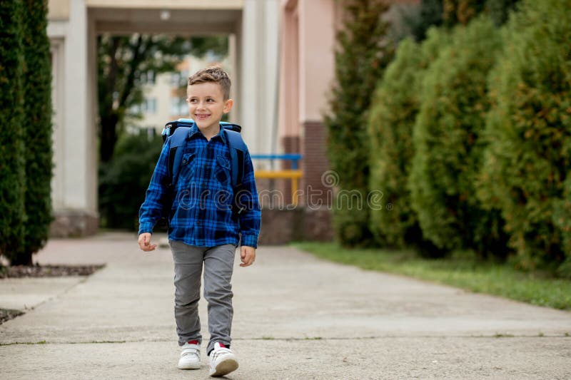 Little First Grader with Backpack Goes Home from School Stock Photo ...
