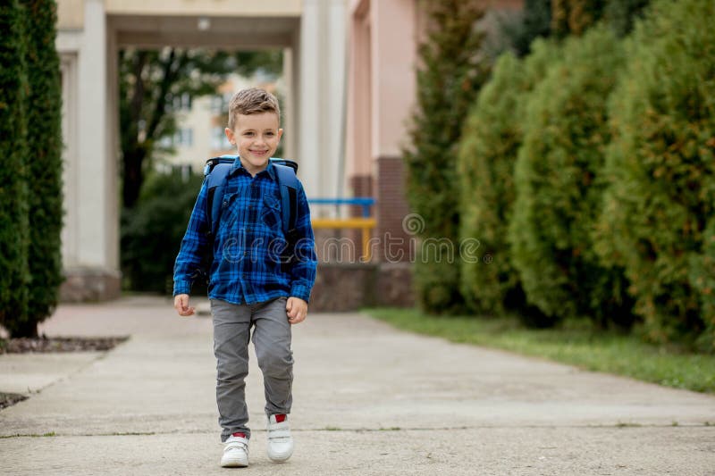 Little First Grader with Backpack Goes Home from School Stock Photo ...