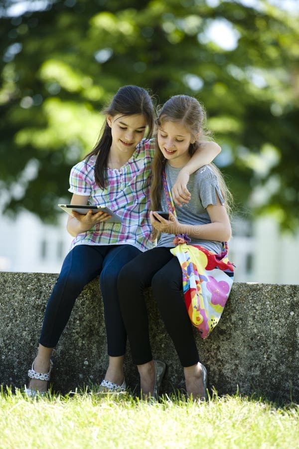 Little Friends with PC Tablet and Mobile Phone Stock Image - Image of ...