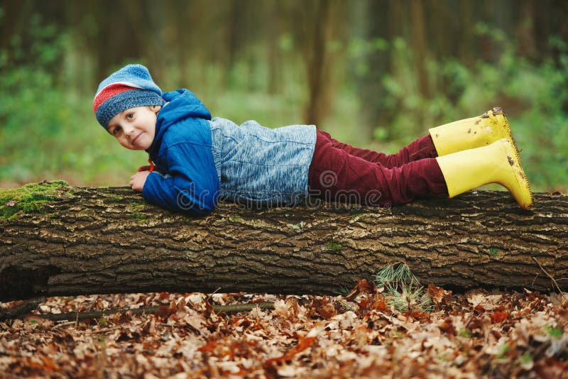 Little Funny Boy on Big Log Stock Image - Image of childhood, lifestyle ...