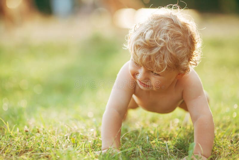 Little funny boy on grass stock photo. Image of happiness - 74176426