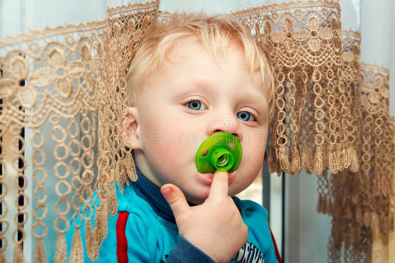 Little Funny Boy with a Pacifier. Stock Photo - Image of pacifier ...