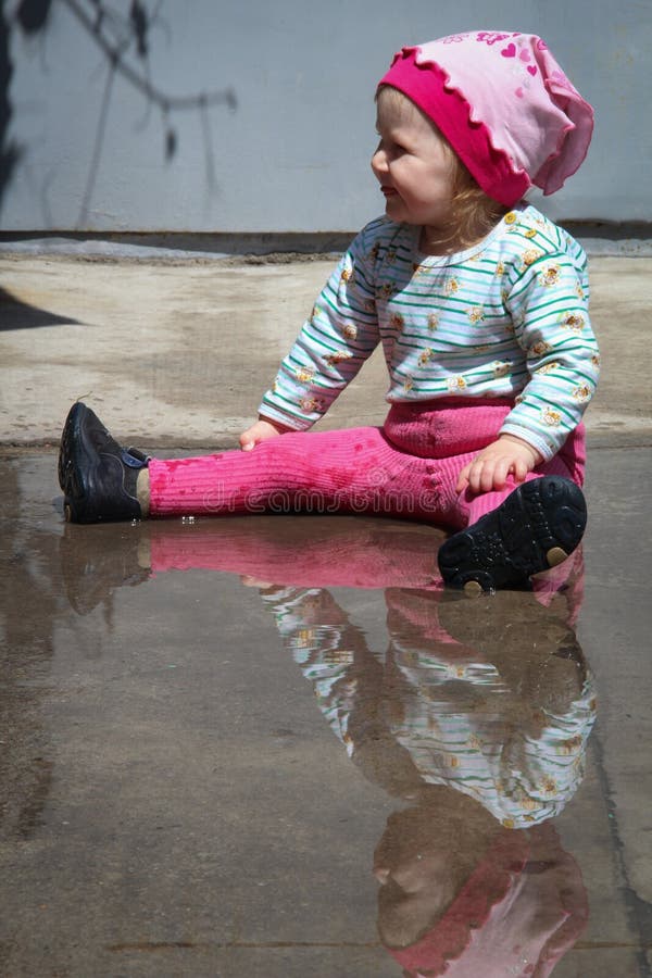 Little Funny Girl Playing with Water in Puddle Stock Image - Image of ...
