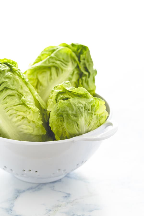 Little Gem Lettuce in the Colanders on Marble Tabl Stock Photo - Image ...
