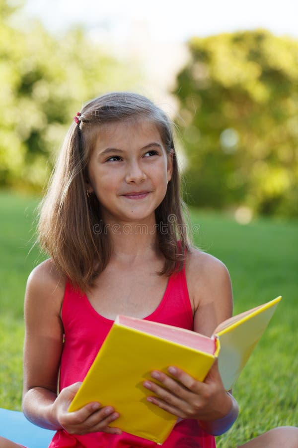 Little Genius with Yellow Book Stock Photo - Image of 1012, back: 36275636