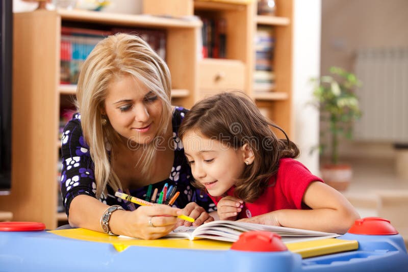 Teacher Teaching Little Girls in Classroom Stock Photo - Image of ...
