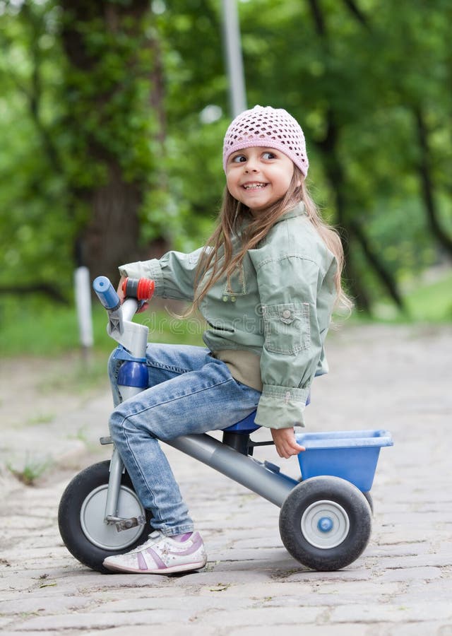 Little Girl ( 4-5) on Tricycle Stock Photo - Image of elementary ...