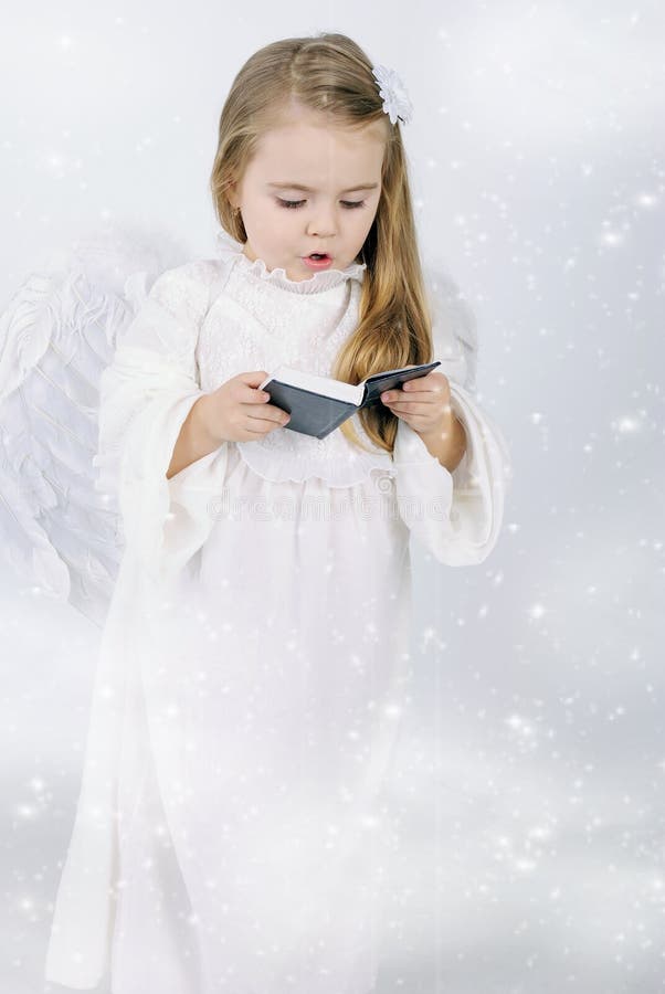 A Little Girl Angel with a Book Stock Photo - Image of prayerbook ...