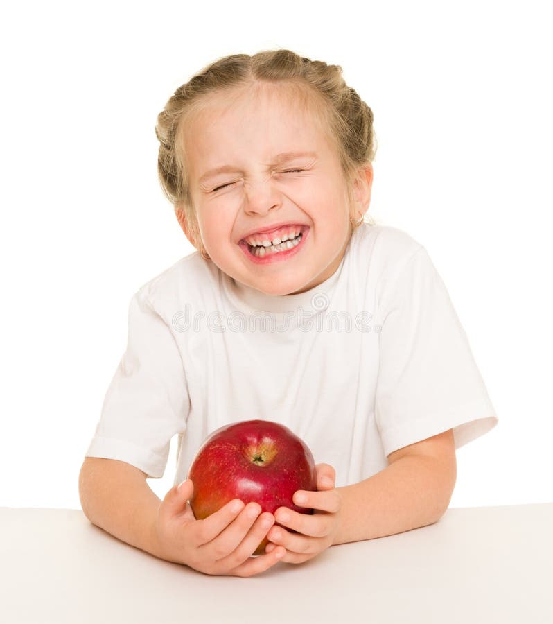 Little girl with apple stock photo. Image of blink, squint - 45477128