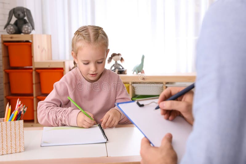 Child Psychotherapist Having Conversation with Little Girl Stock Photo ... Child Psychotherapist Having Conversation with Little Girl Stock Photo ...