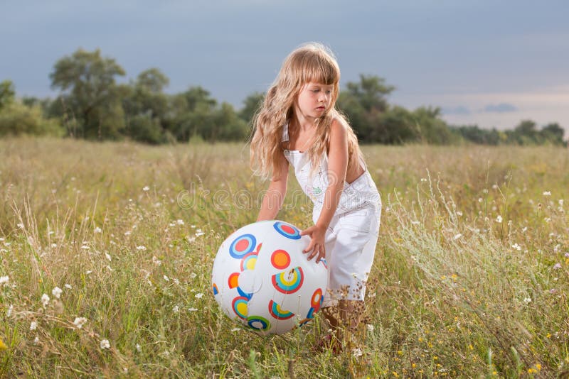 Little girl with ball stock image. Image of ecoregion - 15707073