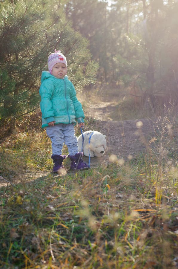 Little girl with bear stock photo. Image of nature, plush - 46944322