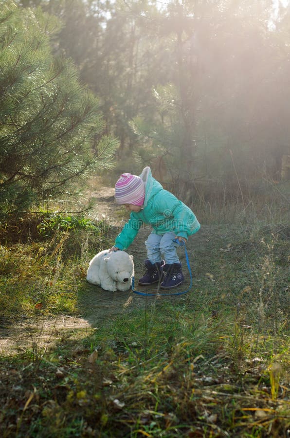 Little girl with bear stock photo. Image of trail, forest - 46944340