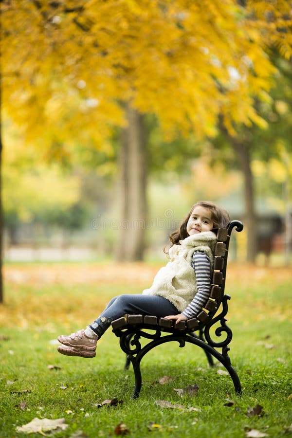 Little girl at the bench stock image. Image of female - 58284507