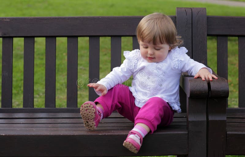 Little girl on the bench stock photo. Image of bench - 31809128