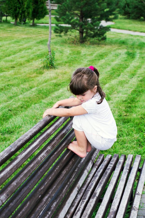 Little girl on a bench stock image. Image of friendship - 44291631