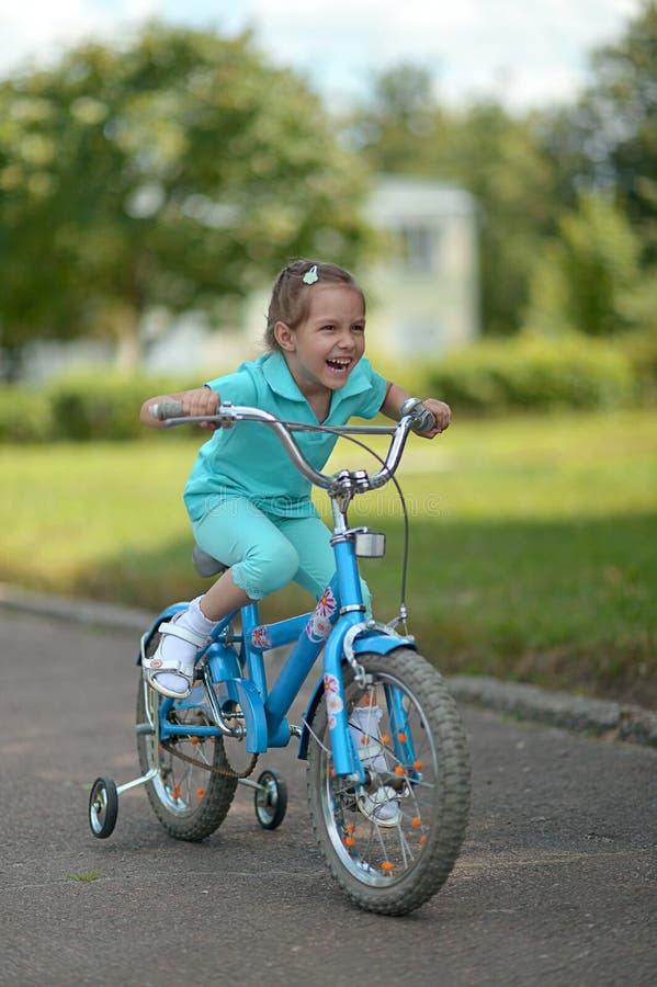 Little girl with bicycle stock image. Image of bicyclist - 47951519