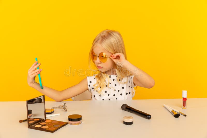 Little Girl Blogger in the Yellow Studio in Front of Camera Making ...