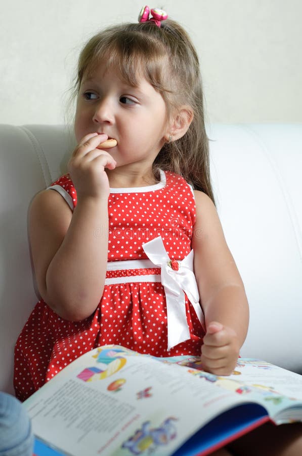 A little girl with a book stock image. Image of little - 11052105