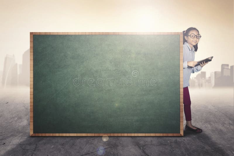Little Girl with Book Behind a Chalkboard Stock Photo - Image of asian ...