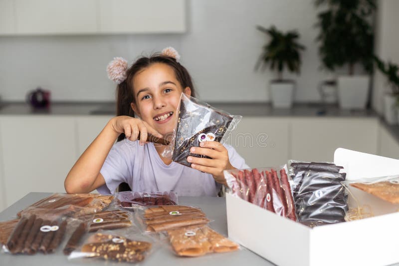 Little Girl with a Box of Pastilles Stock Image - Image of slice, roll ...