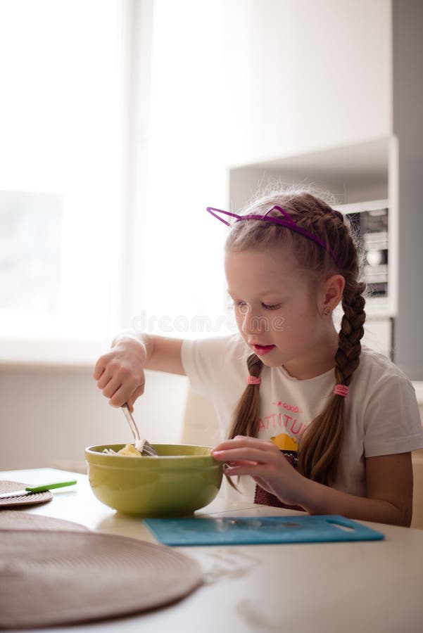 Little Girl with Braids is Cooking in the Kitchen Stock Image - Image ...
