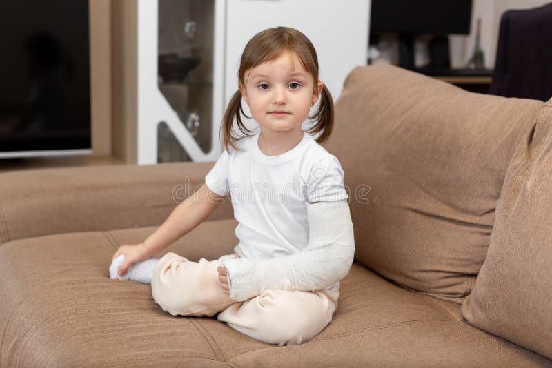 A Little Girl with a Broken Arm and a Cast Stock Photo - Image of ...