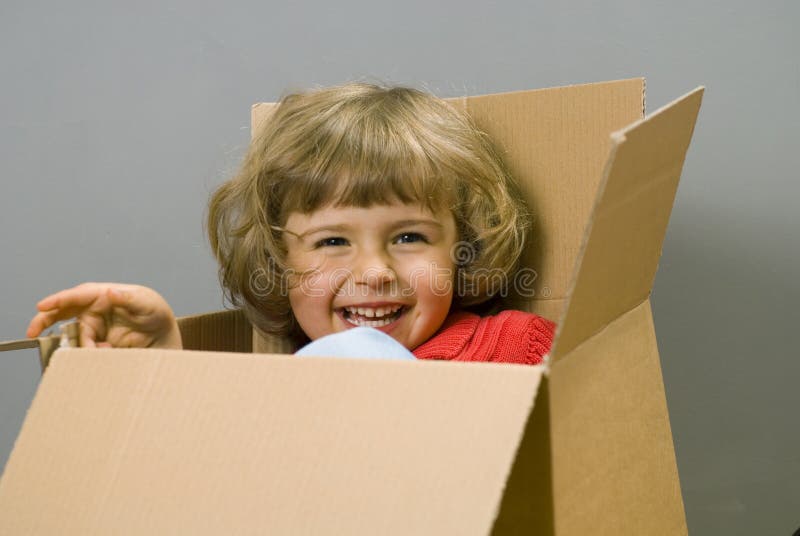 Little Girl with Cardboard Box Stock Image - Image of look, home: 3436217