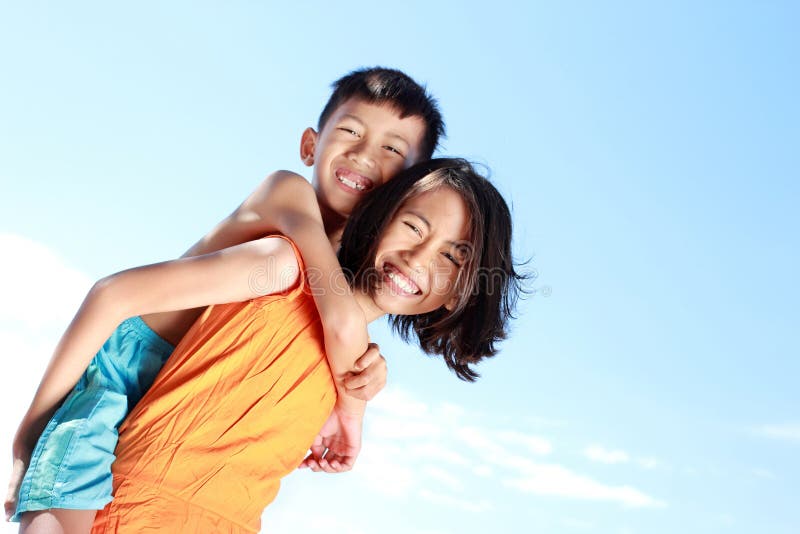 Little Girl Carrying Her Brother Stock Photo - Image of male, person ...