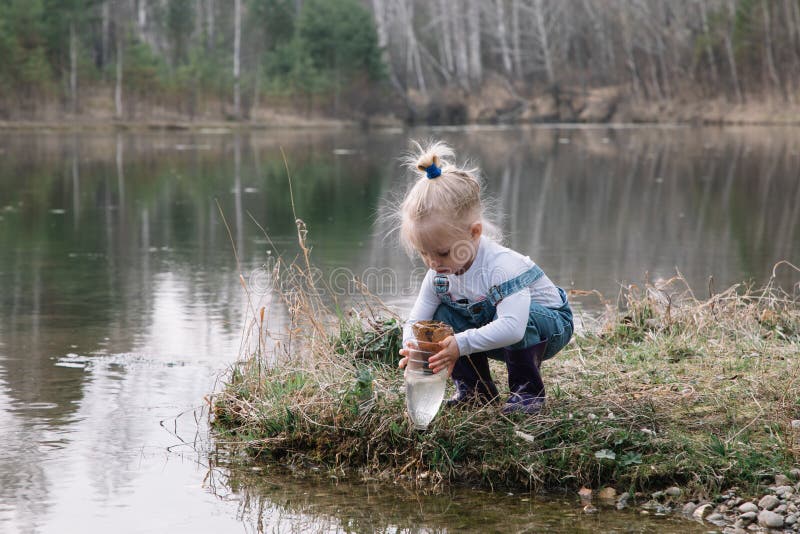 Little Girl Catches and Feeds Fish Stock Image - Image of river ...