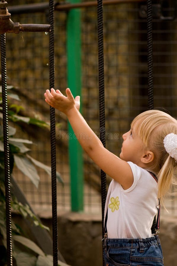 Little girl catching water stock photo. Image of caucasian - 10848984