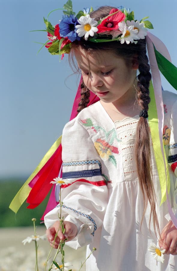 Midsummer. Two Girls in the Slavic Clothes Weave Braids in the Hair ...