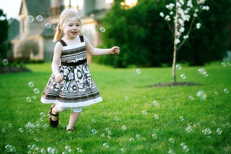 Little Girl Chasing Bubbles Stock Photo - Image of bliss, little: 11785404