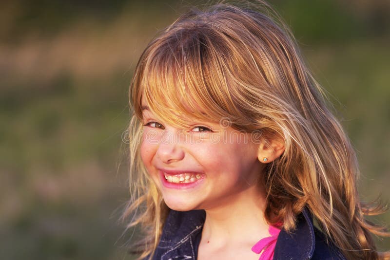 Little Girl with Cheeky Smile Stock Photo - Image of childhood, delight ...