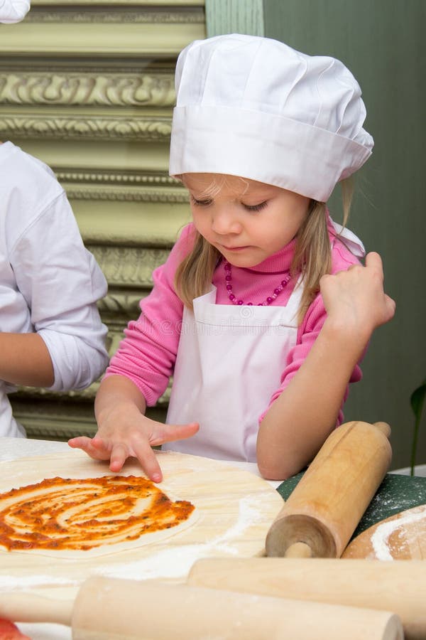 Little Girl in Chefs Hat is Cooking Pizza Stock Photo - Image of food ...