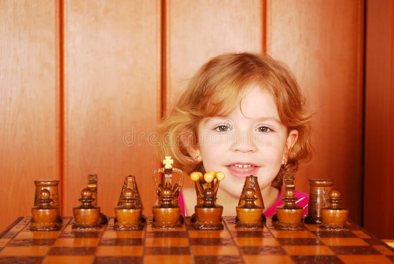 Girl playing big chess set stock image. Image of winner - 194757
